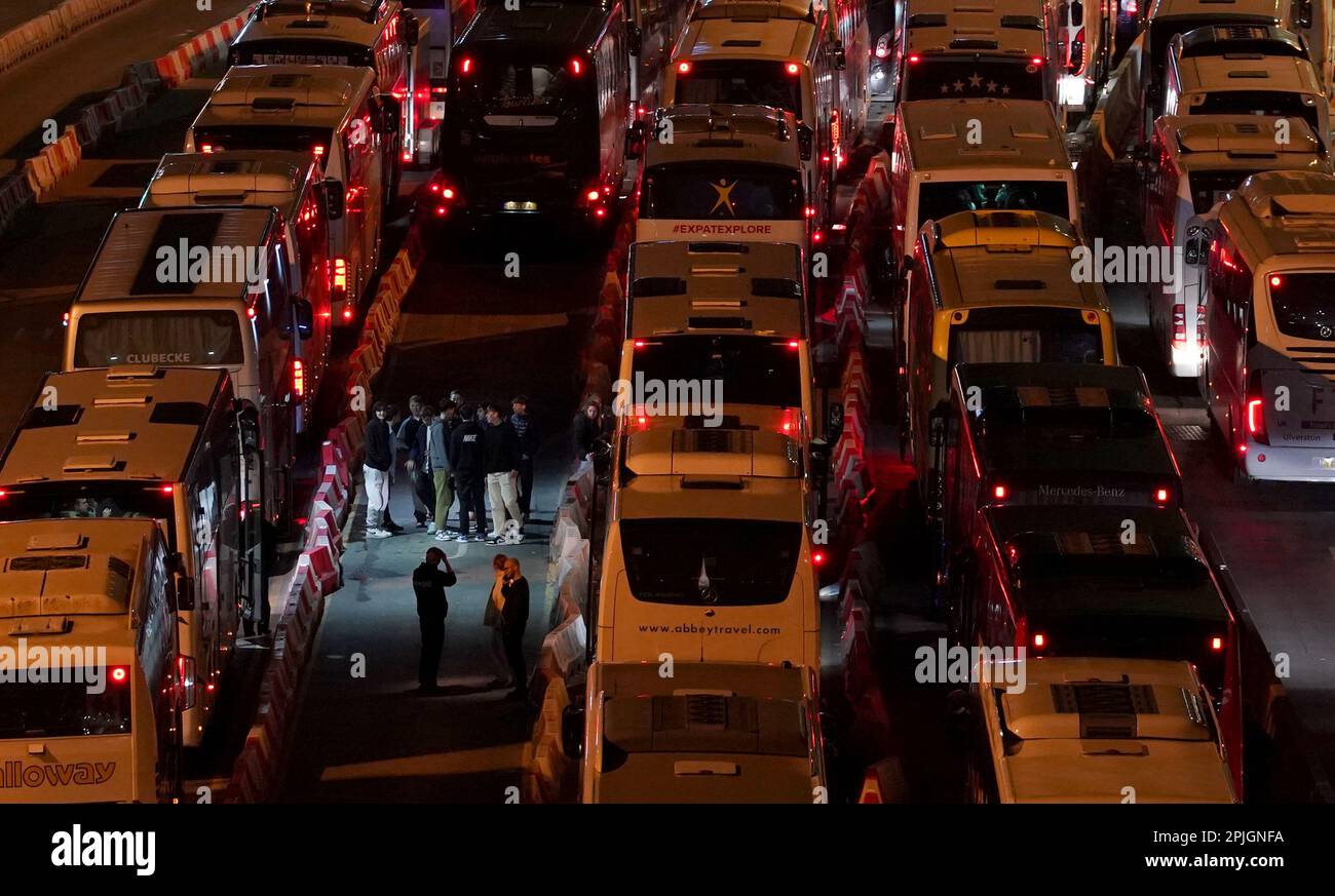 Coaches wait in to the evening to enter the Port of Dover in Kent after ...