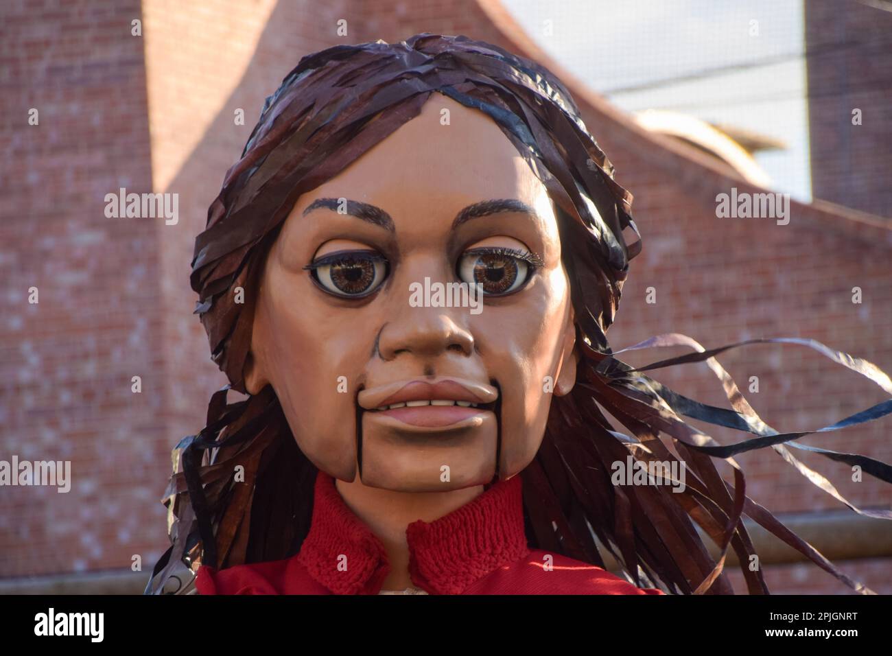 London, UK. 2nd April 2023. Little Amal, the 3.5-metre-tall puppet of a ...