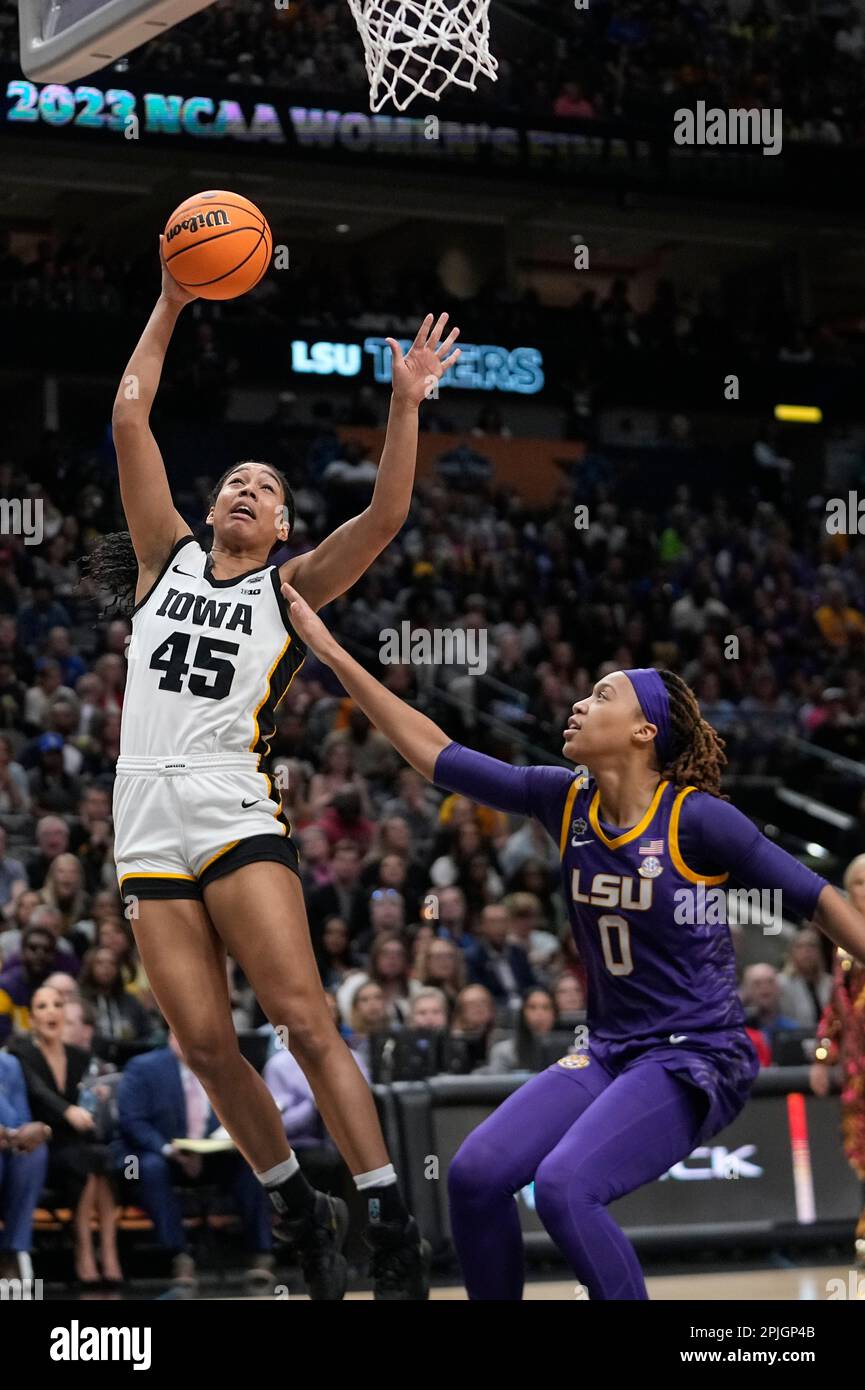 Iowa's Hannah Stuelke shoots past LSU's LaDazhia Williams during the ...