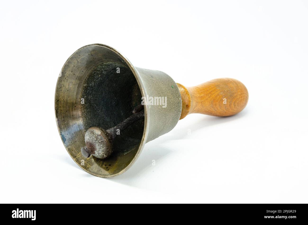 A school hand bell isolated against a white background Stock Photo - Alamy
