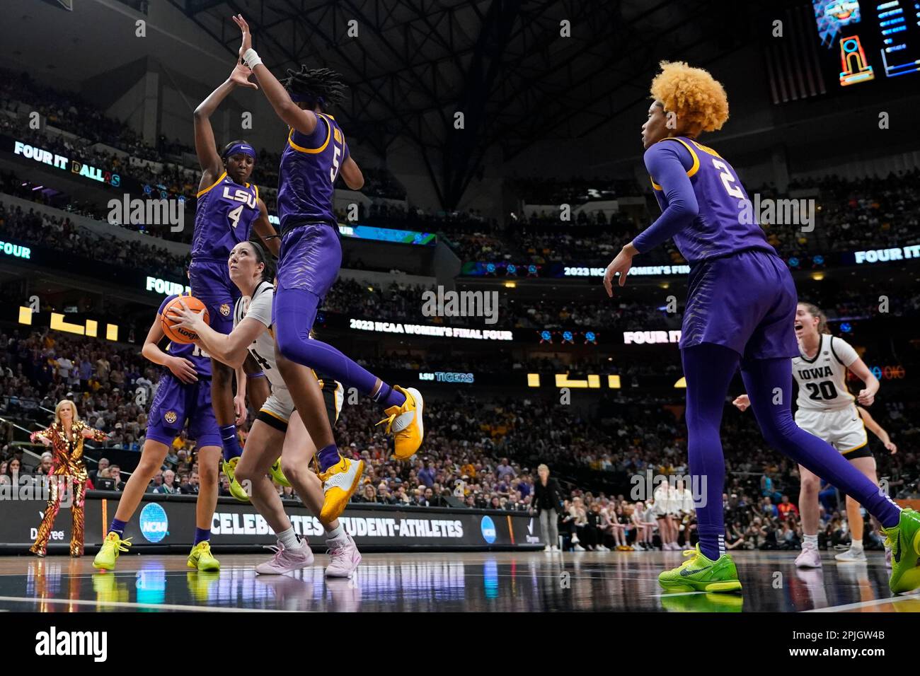 Iowa's McKenna Warnock is stopped by LSU's Sa'Myah Smith and Flau'jae ...