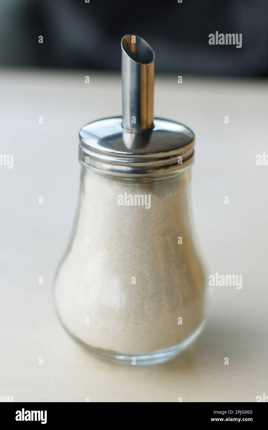 Transparent sugar bowl from white sugars in cafe Stock Photo - Alamy