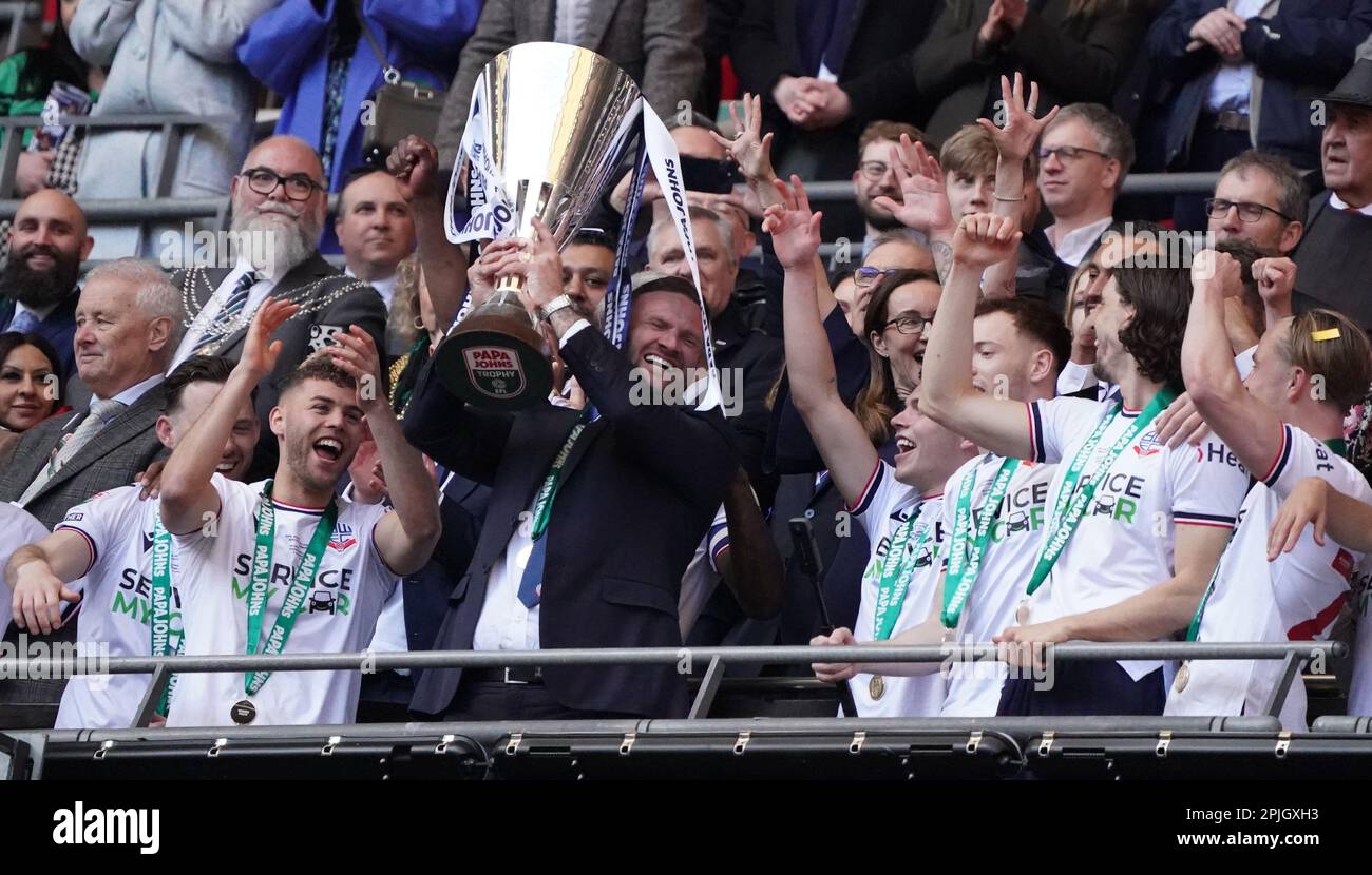 LONDON, ENGLAND - APRIL 02: Bolton manager Ian Evatt lifting the trophy ...