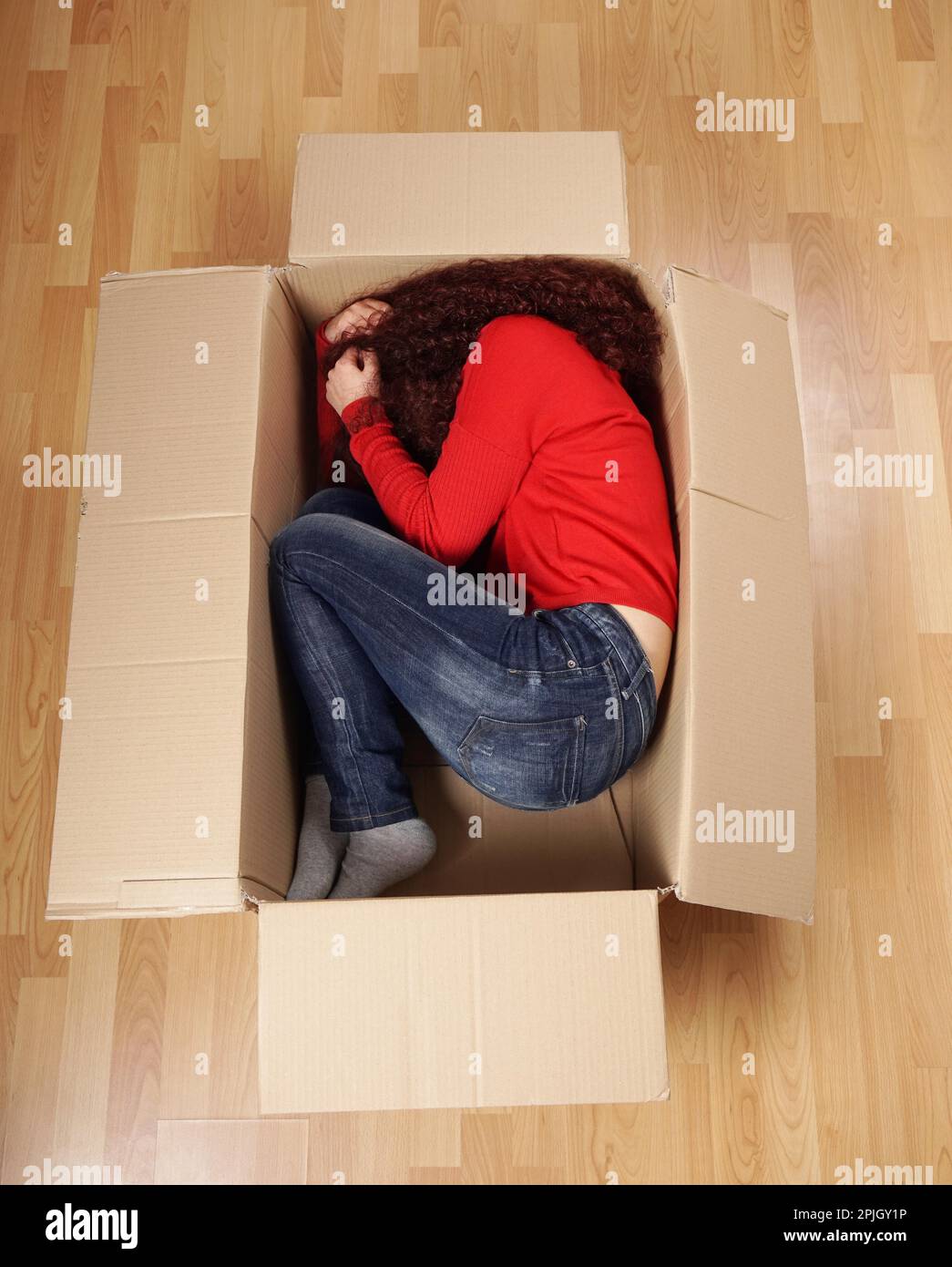 Curled up person hi-res stock photography and images - Alamy