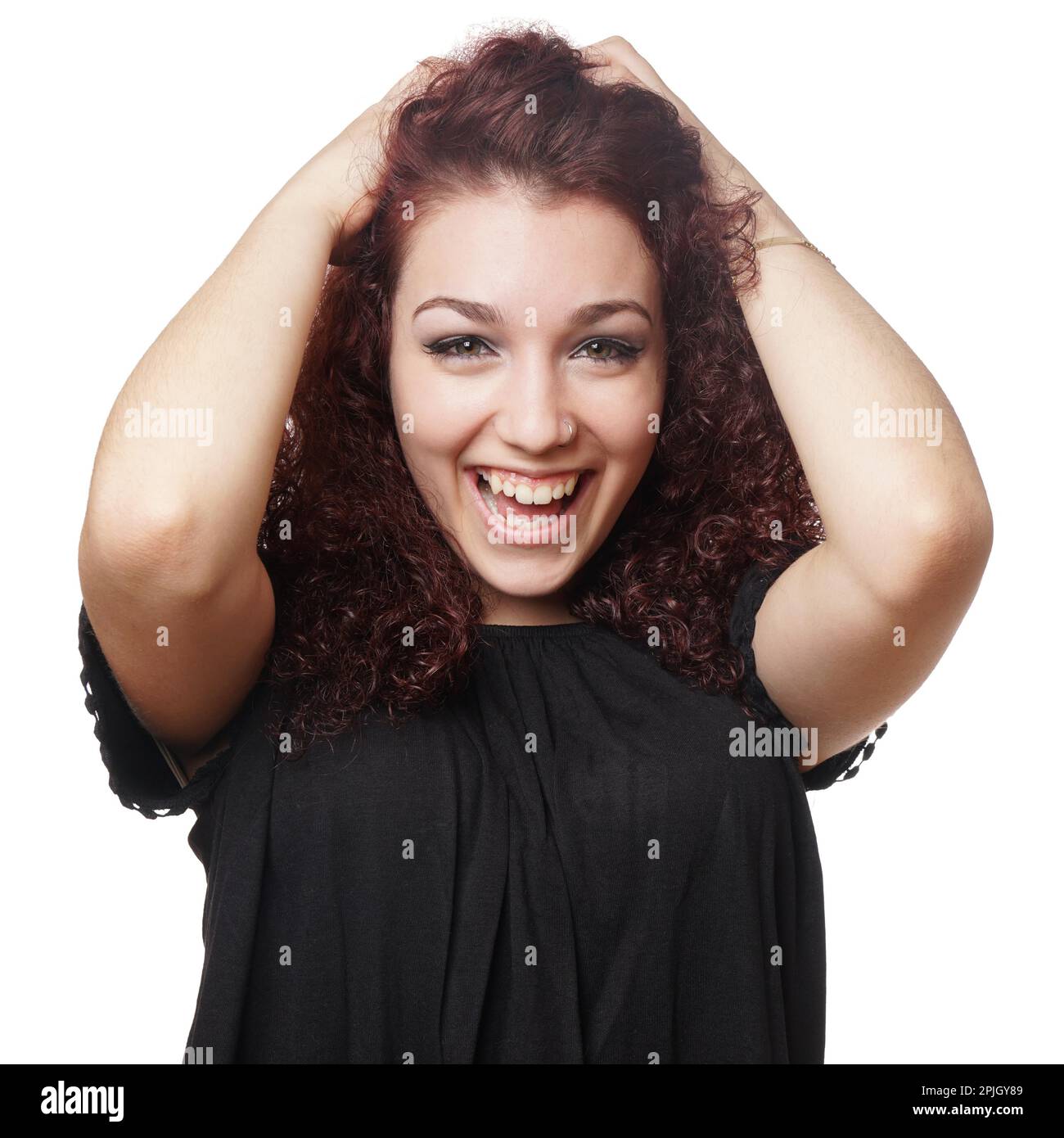 excited young teenage woman beaming with delight Stock Photo - Alamy