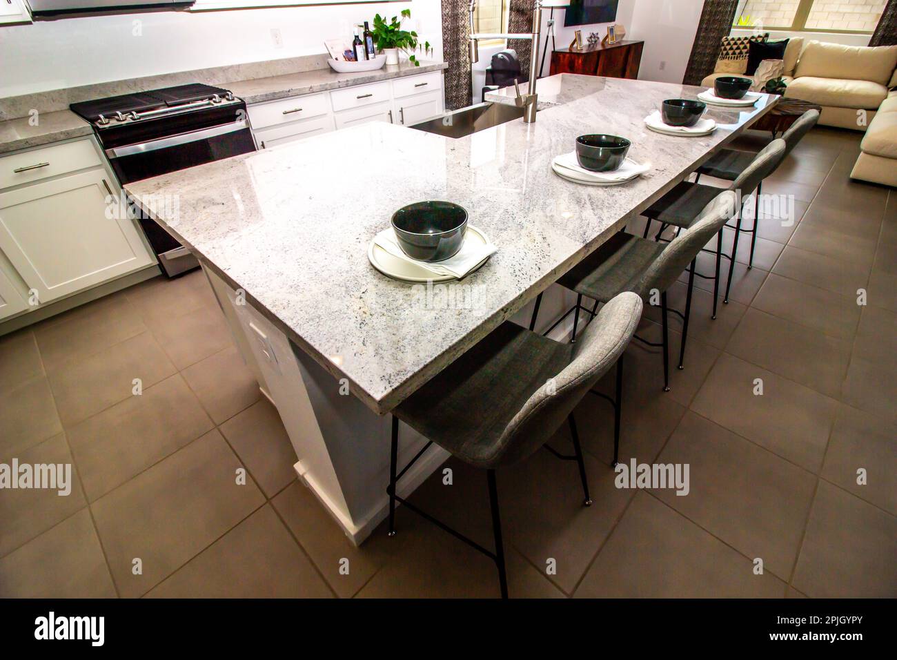 Kitchen Island With Four Place Settings Stock Photo - Alamy