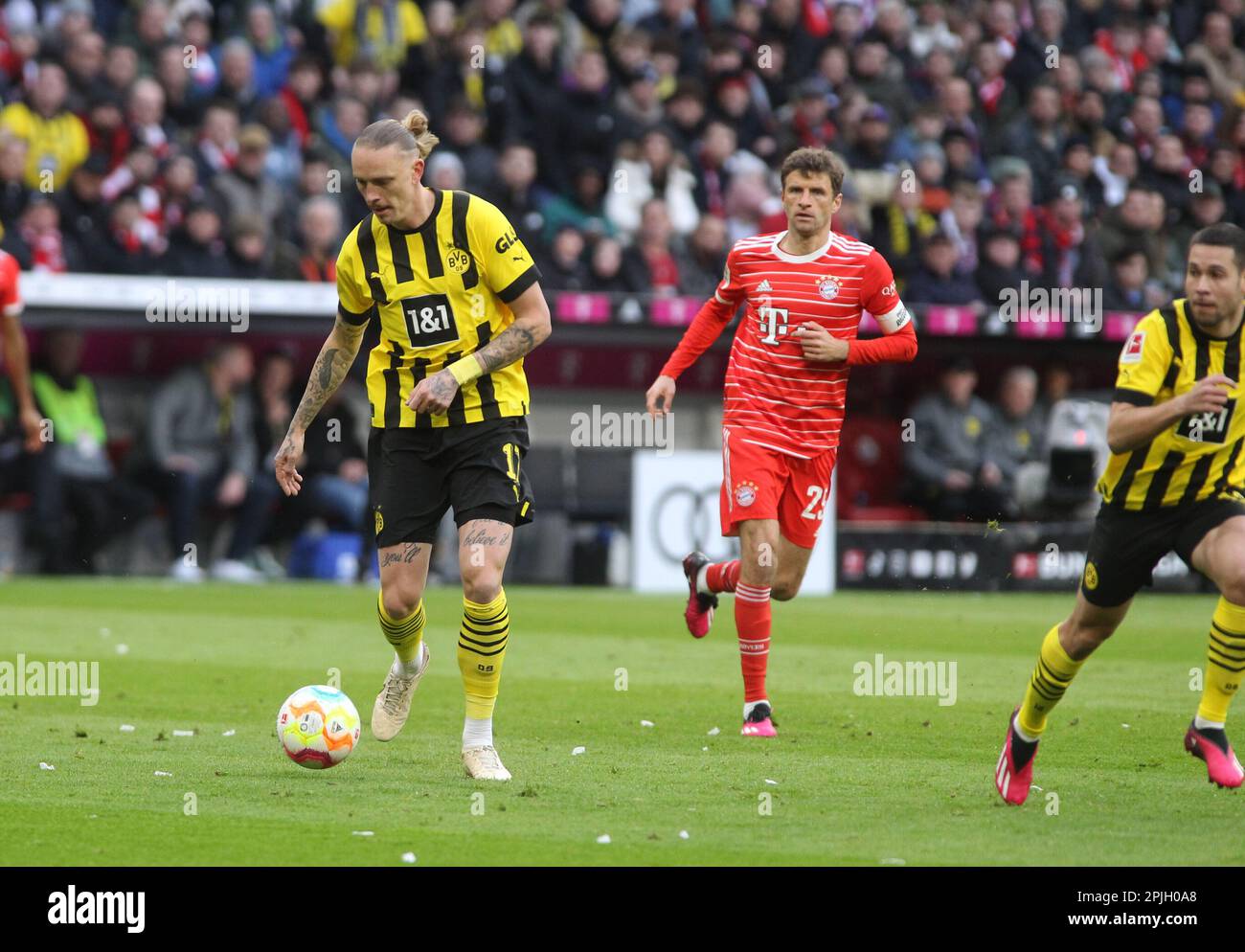 MUNICH, Germany - 01. APRIL 2023: 17 Marius WOLF of BvB and 25 Thomas ...