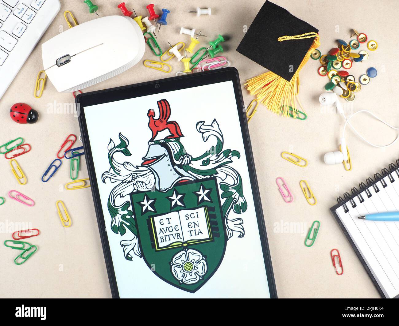 In this photo illustration, the University of Leeds logo seen displayed ...