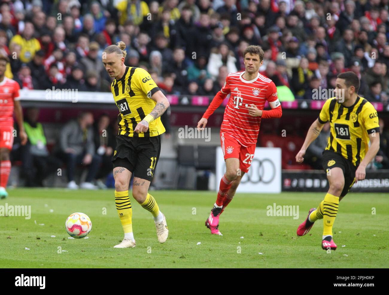 MUNICH, Germany. , . 17 Marius WOLF of BvB and 25 Thomas MUELLER ...