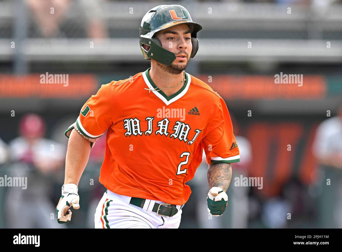 CORAL GABLES, FL - APR 01: Miami infielder CJ Kayfus (2) runs to first ...