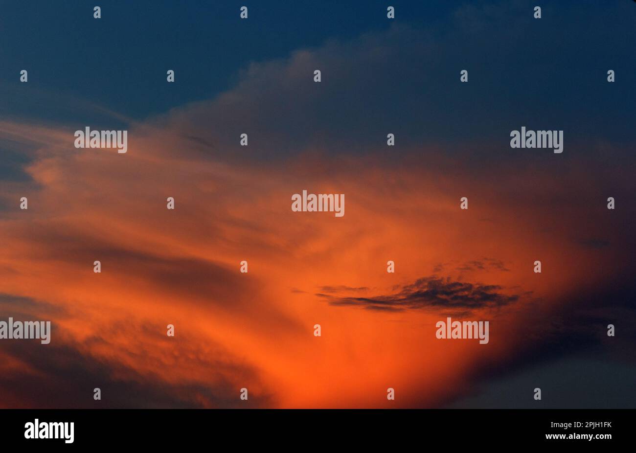 Bright red sunset in the sky before a thunder-storm Stock Photo - Alamy