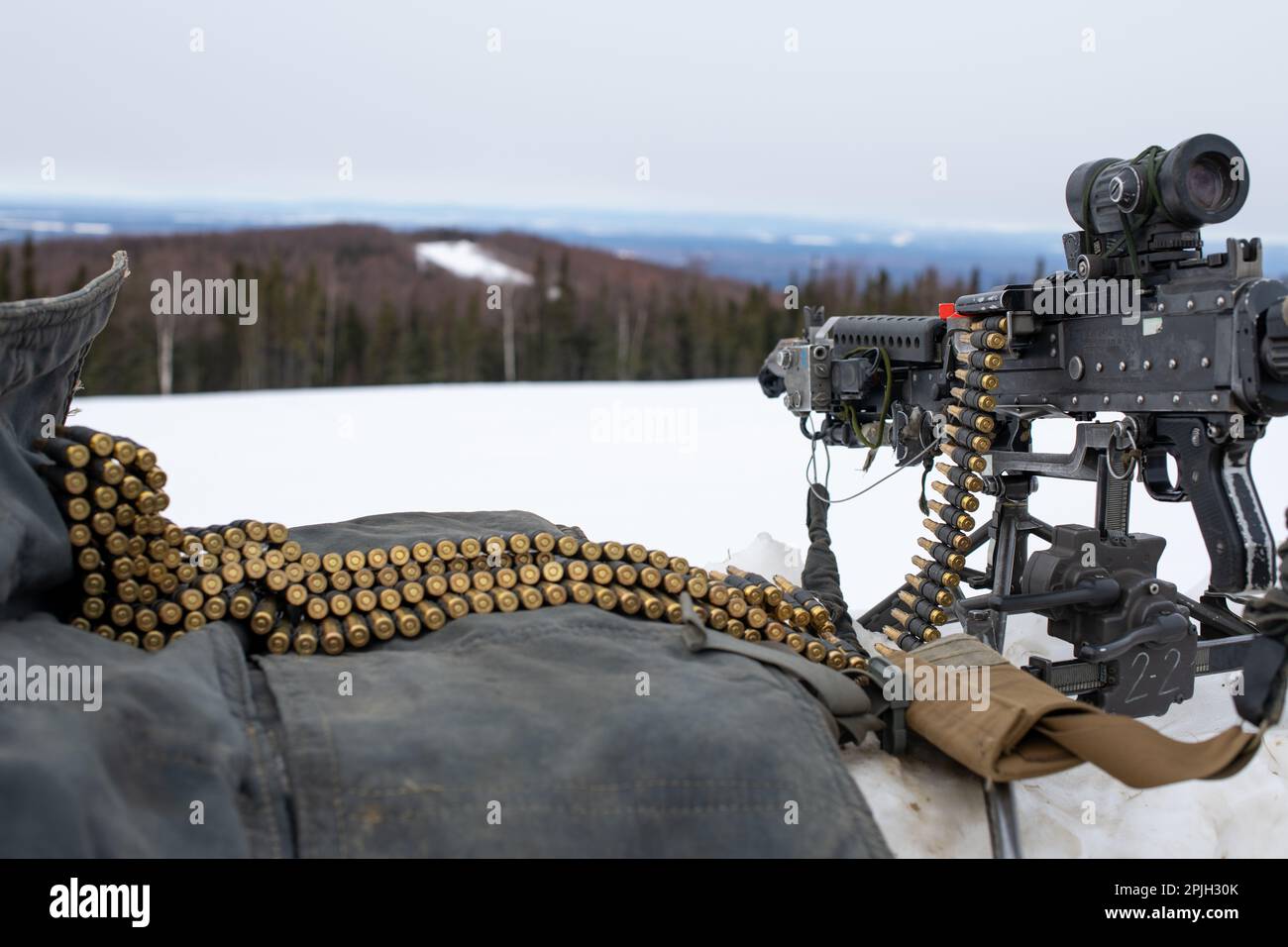 A U.S. Army M240B machine gun lies at a firing position maintained by ...