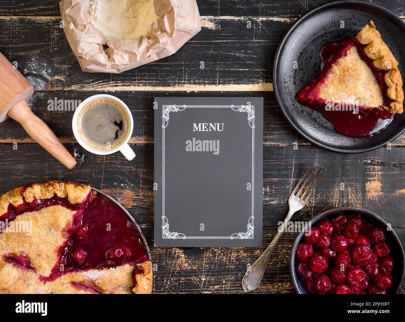 Baking background with sliced cherry pie, flour, rolling pin and menu ...