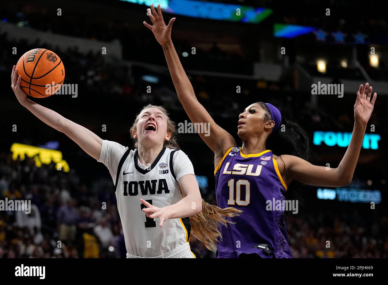Iowa's Molly Davis shoots past LSU's Angel Reese during the second half ...