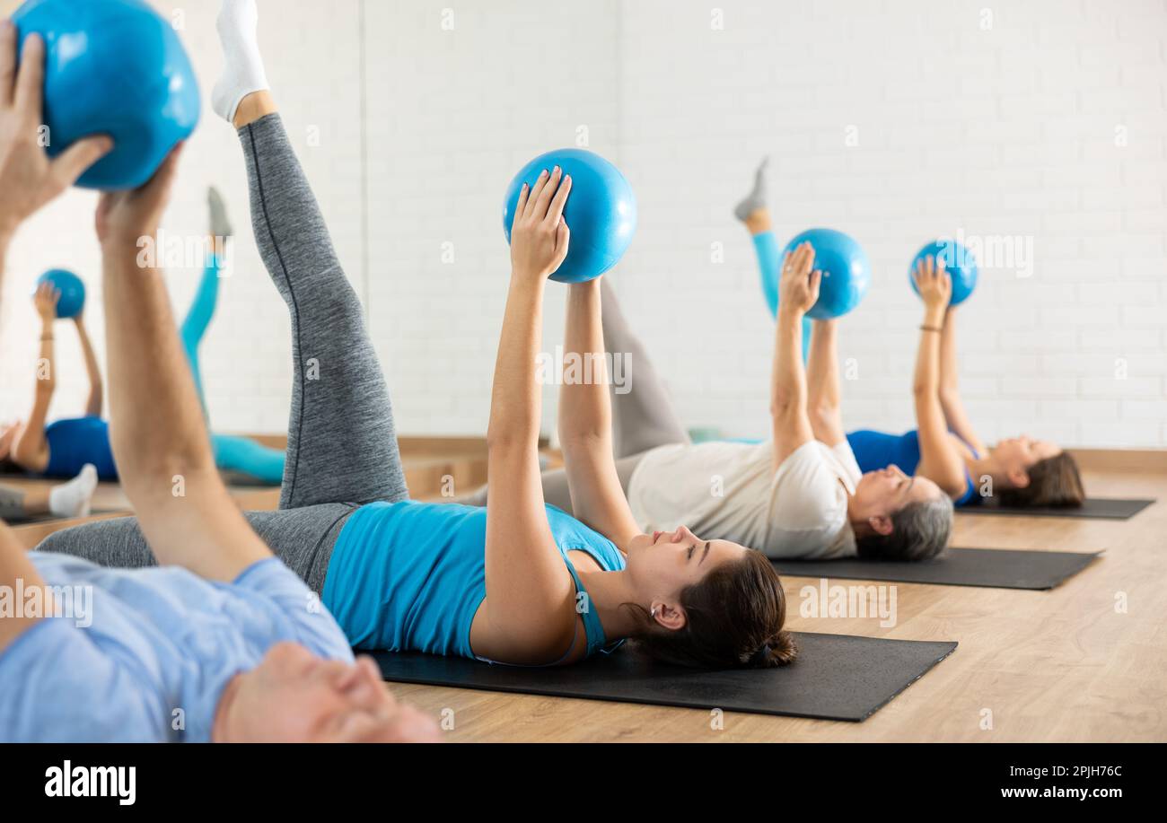 Young girl training with bender ball at gym Stock Photo - Alamy
