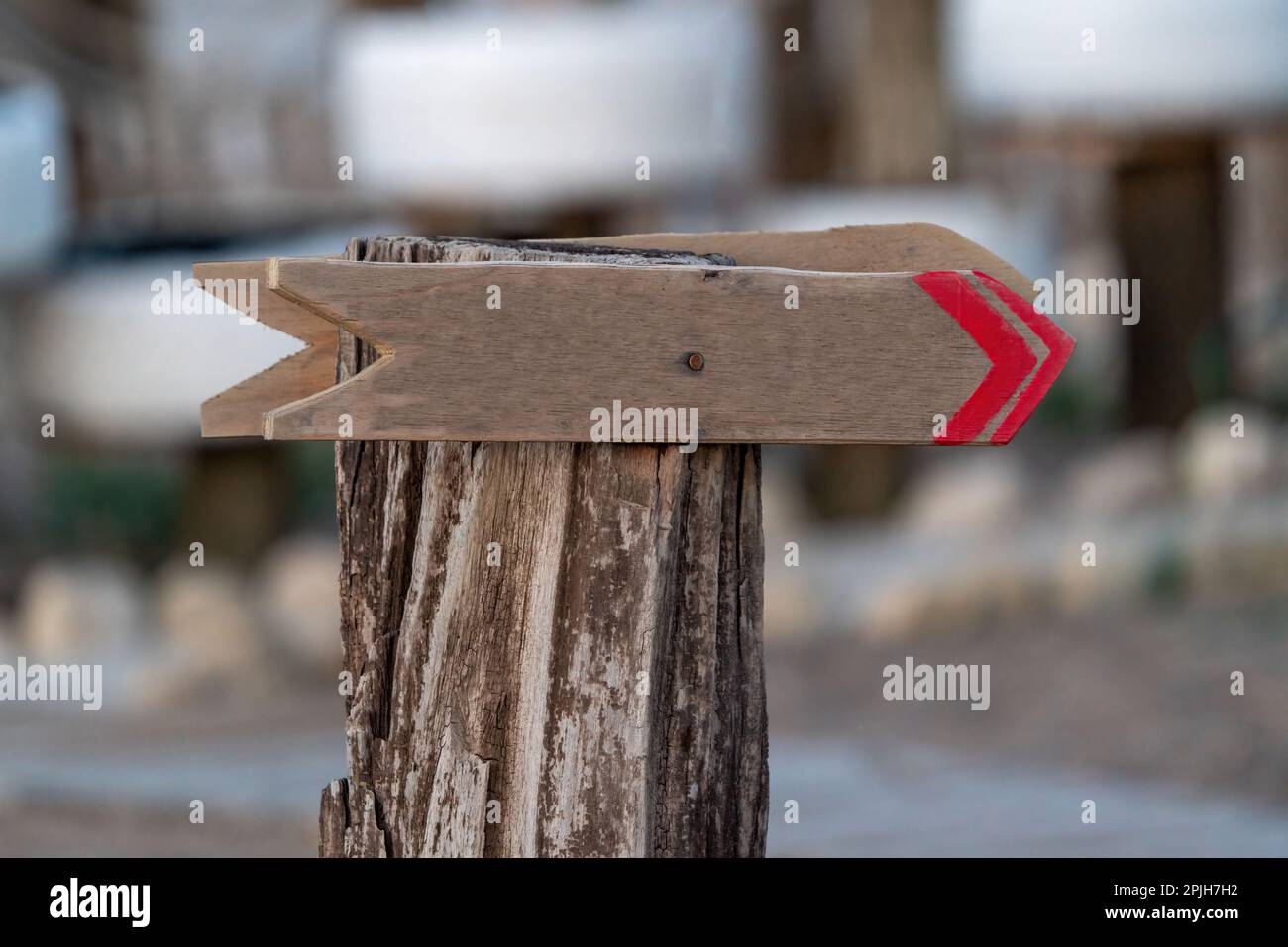 wooden signboard with this way in the beach Stock Photo - Alamy