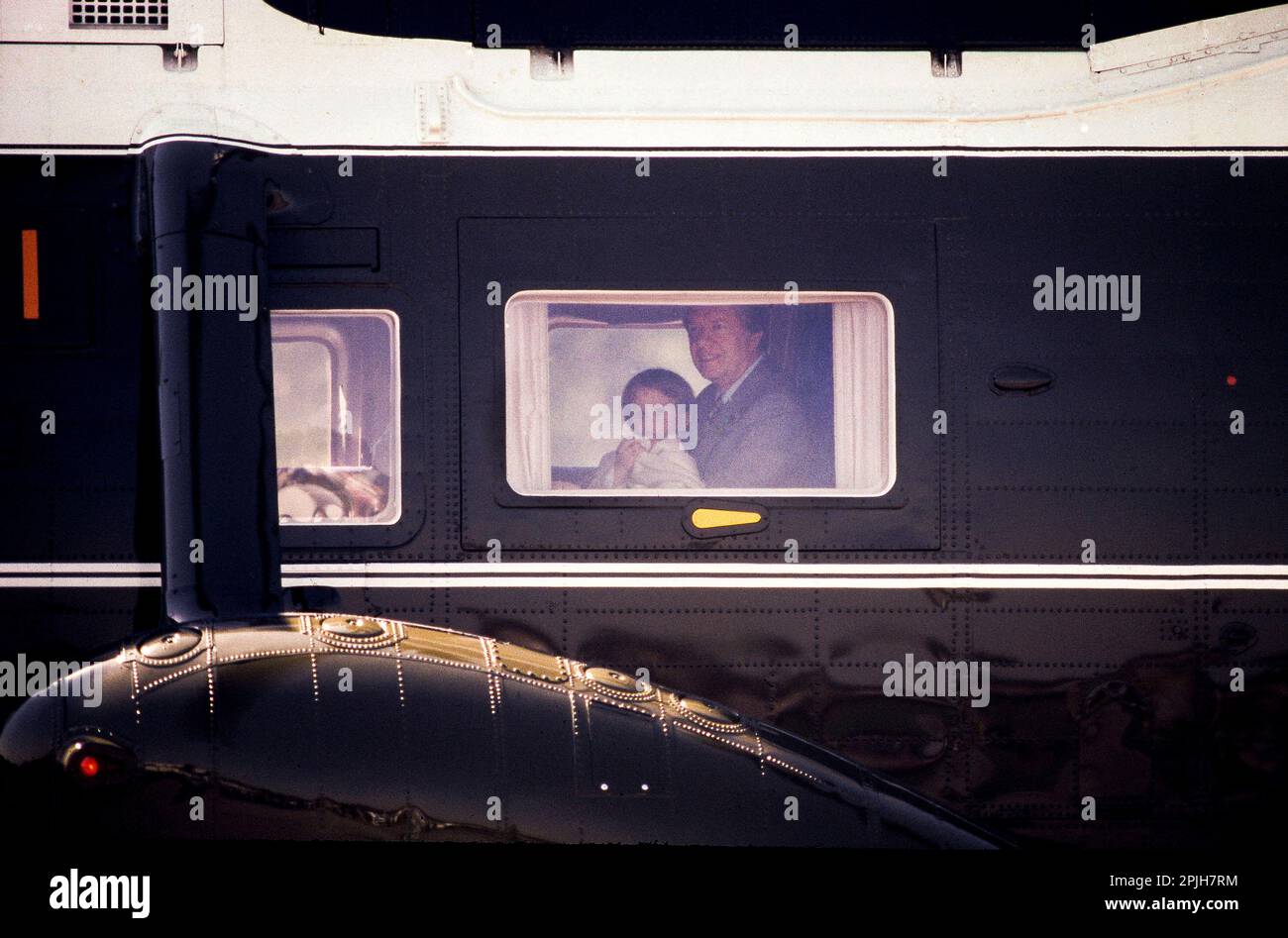 President Jimmy Carter holds grandson Jason Carter in the window of ...