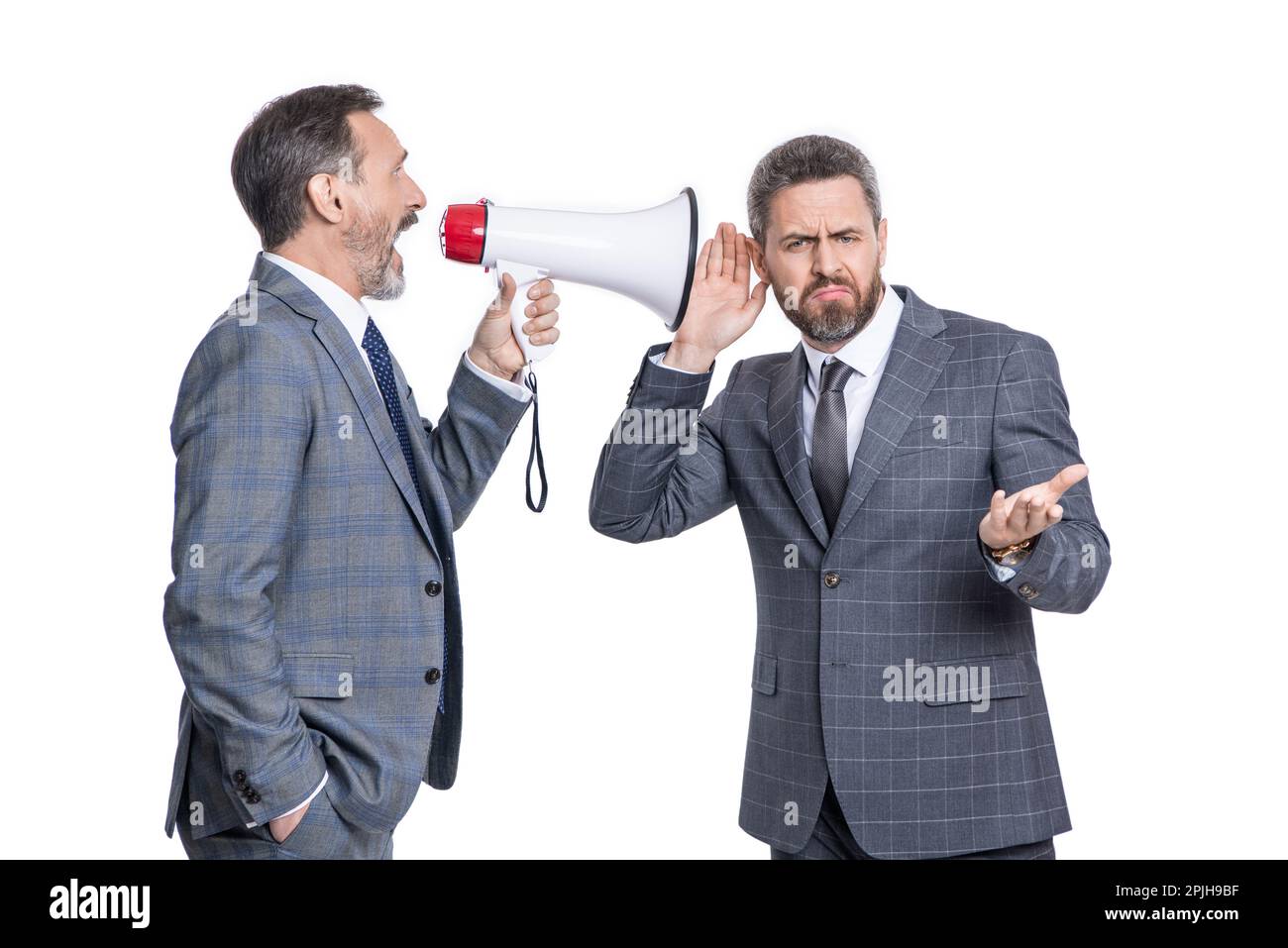 two businessmen hear shouting in loudspeaker. businessmen shouting in ...