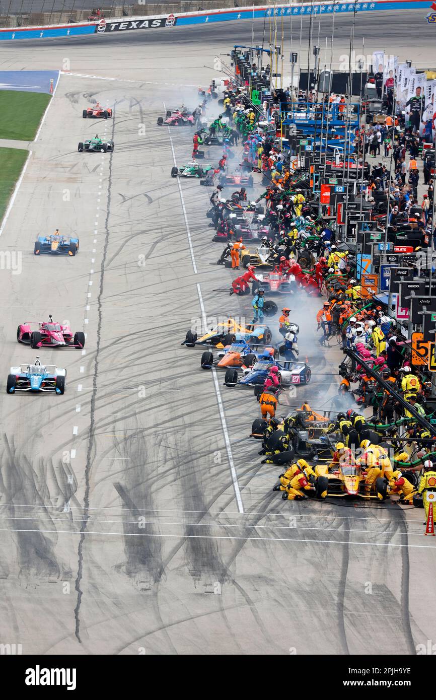 FORT WORTH, TX - APRIL 02: IndyCar drivers pit at the same time during ...