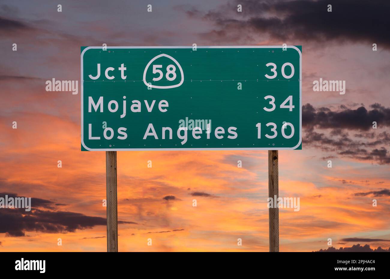 Mojave, Los Angeles and Route 58 junction highway sign with sunset sky ...
