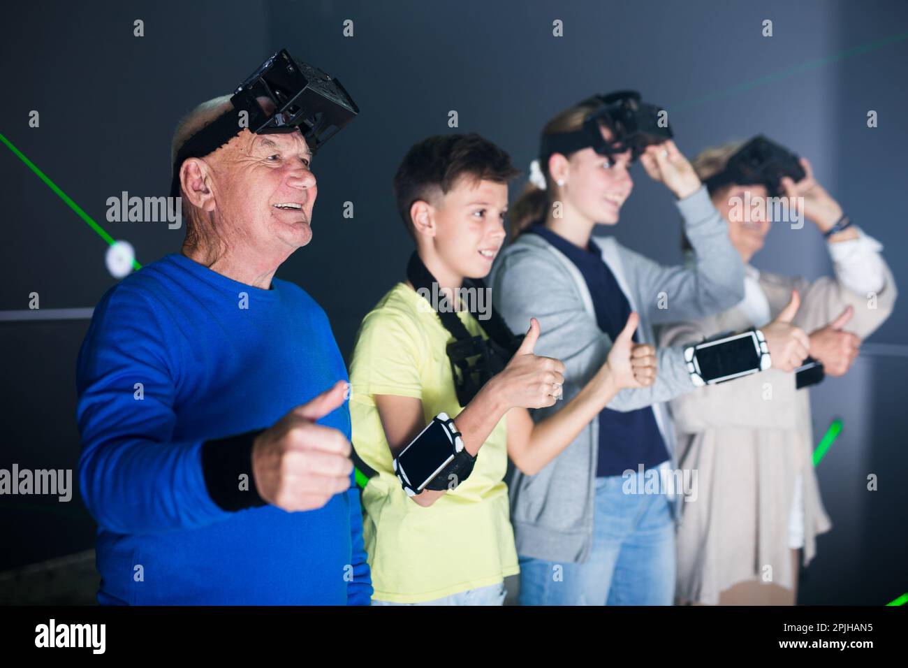 Group photo of happy family in VR headsets Stock Photo - Alamy