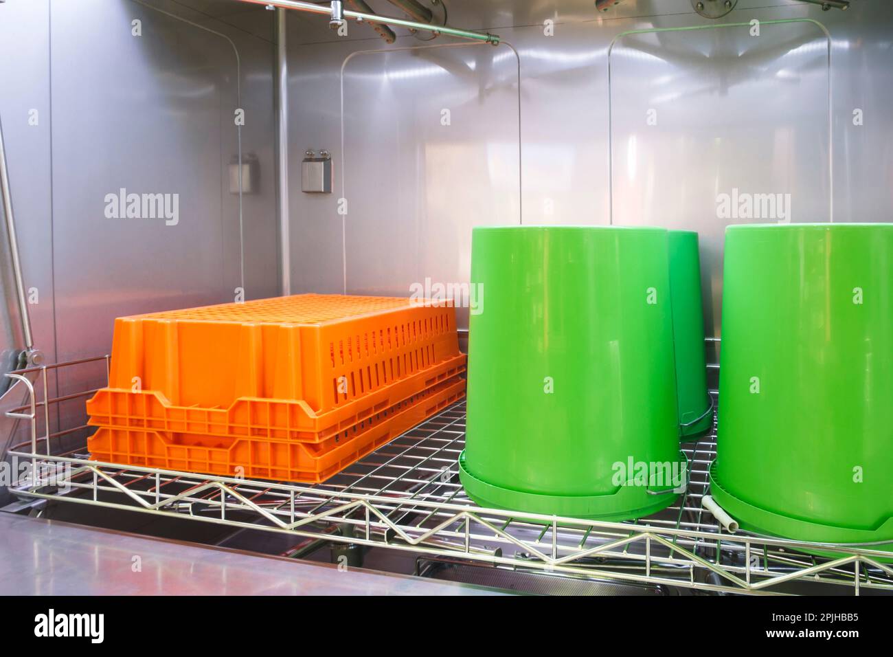 Industrial washing machine with drawers and buckets inside in a ...