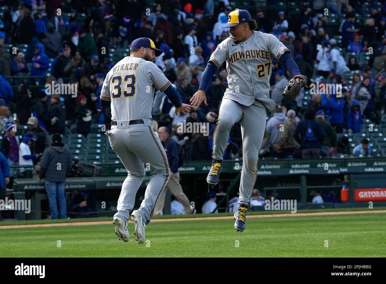 Milwaukee Brewers left fielder Jesse Winker, left, and shortstop Willy ...