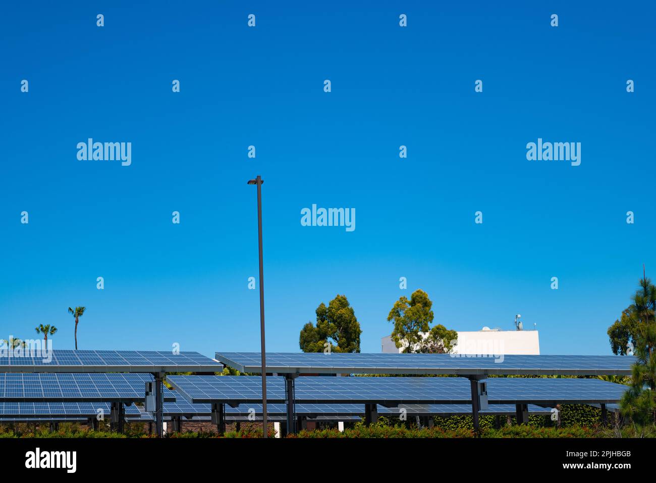 Solar electric panels on bright blue sky. Photovoltaics PV outdoors ...