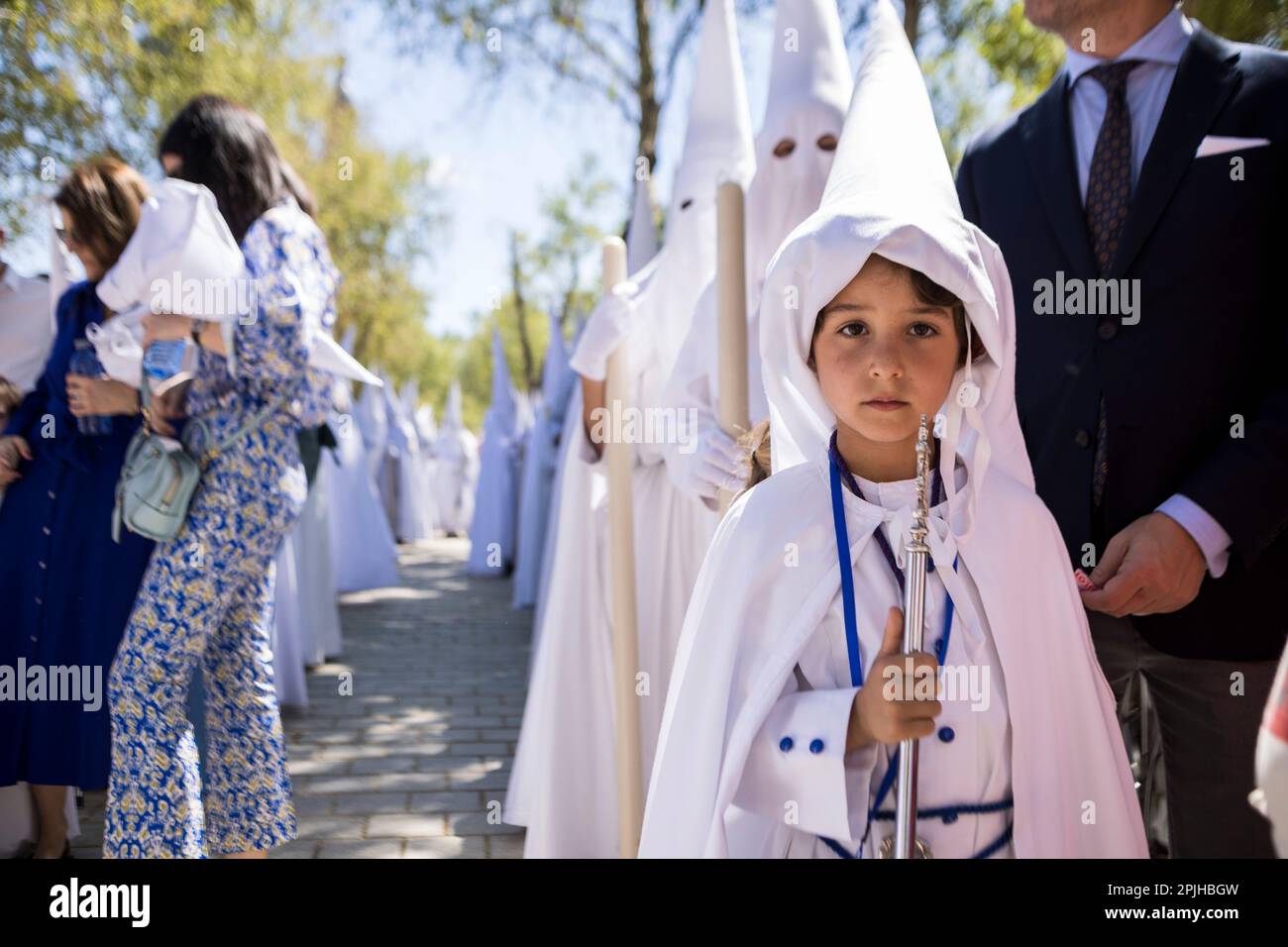 Seville, Spain. 2nd Apr, 2023. A young nazareno of the Brotherhood ...
