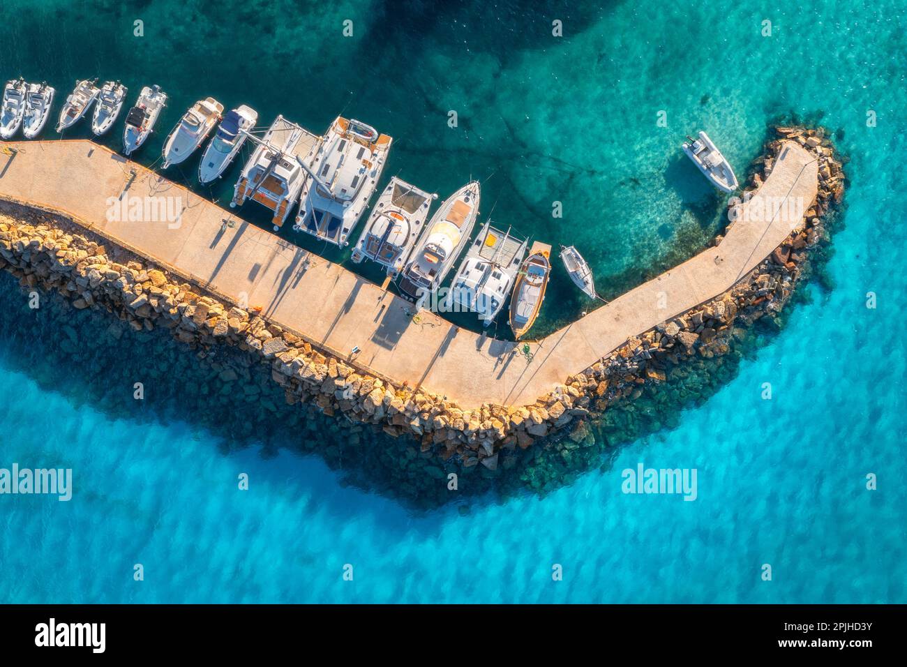 Aerial view of boats and luxury yachts in dock at sunset Stock Photo ...