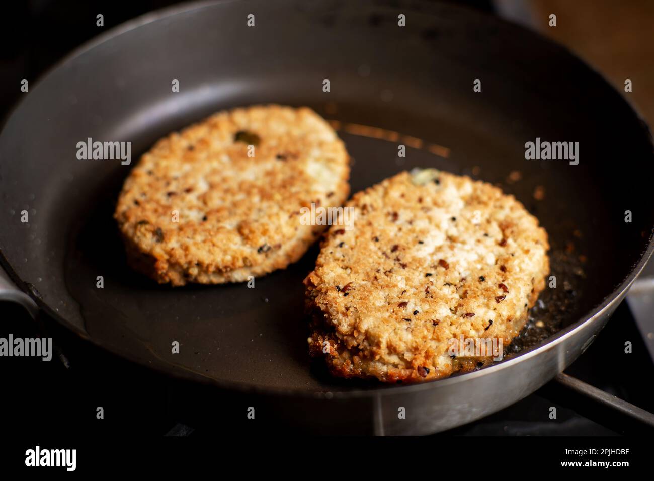 Vegetarian meatballs. Cooking in a pan. Meat alternative food. Cutlets ...