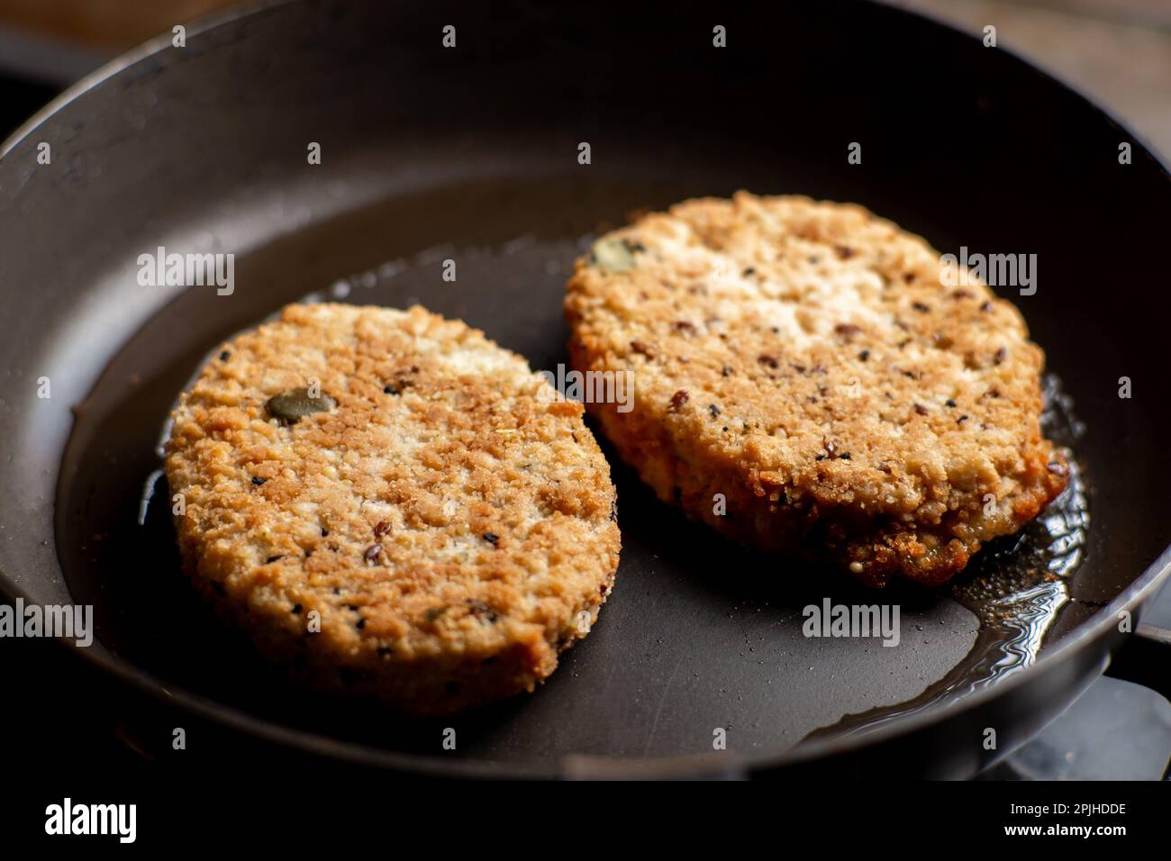 Vegetarian meatballs. Cooking in a pan. Meat alternative food. Cutlets ...