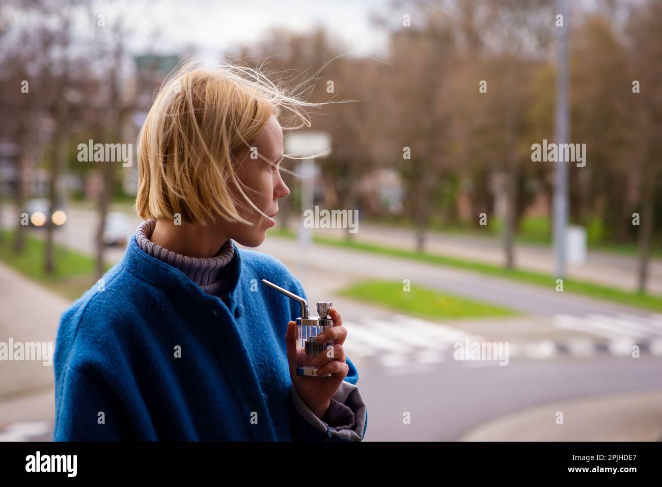 Woman enjoying a smoke hi-res stock photography and images - Alamy