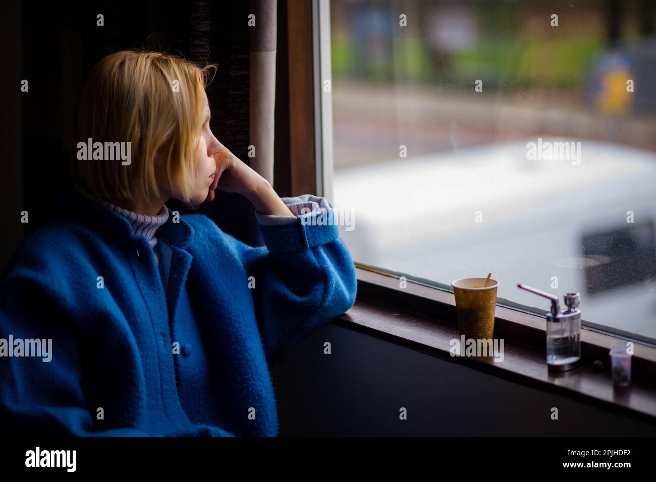 Marijuana and thoughtfulness. A woman in thought, contemplation looks ...