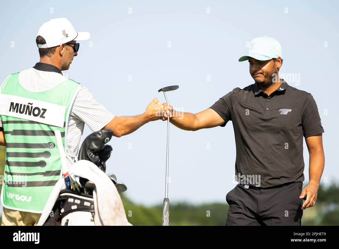 Sebastián Muñoz of Torque GC fist bumps his caddie during the final round of LIV Golf Orlando at ...