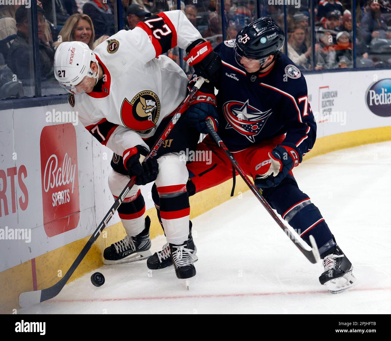 Ottawa Senators forward Dylan Gambrell, left, works for the puck in ...