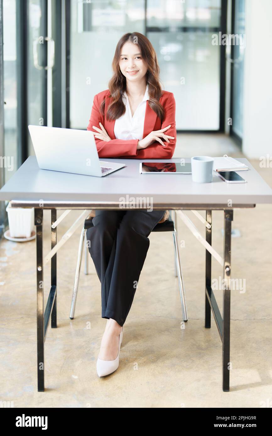 Portrait of a woman business owner showing a happy smiling face as he ...