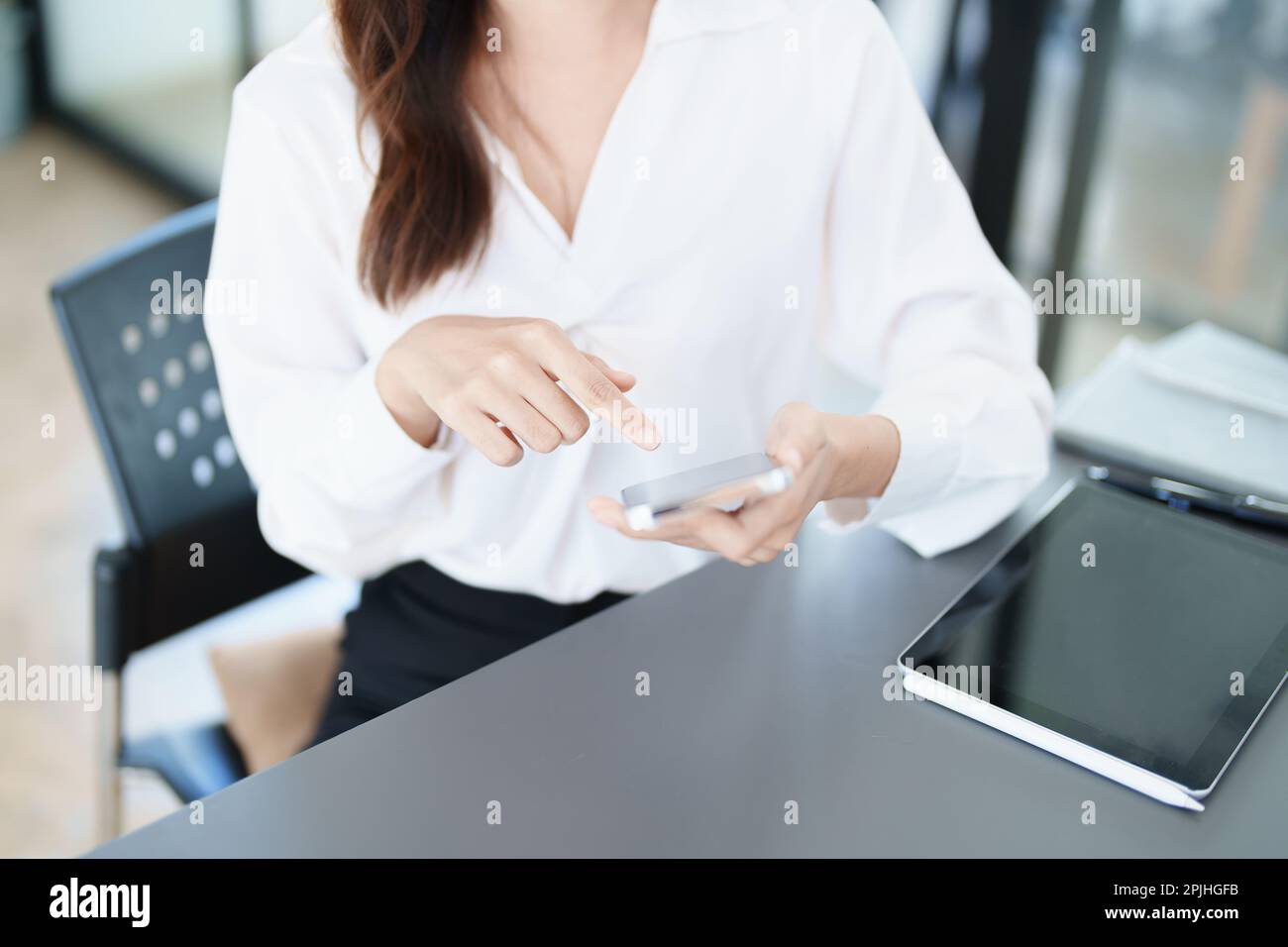 business owner or Asian male marketers are using business phones in ...