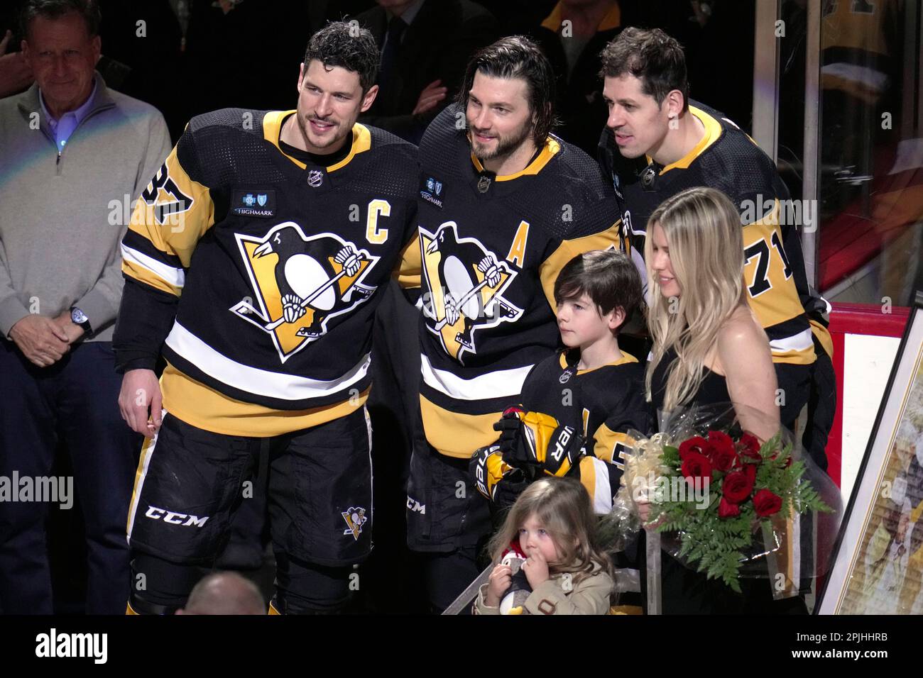 Pittsburgh Penguins' Kris Letang, center, poses for a photo with Sidney Crosby, Evgeni Malkin ...