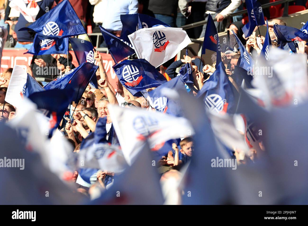 London, UK. 02nd Apr, 2023. Bolton Wanderers fans wave flags as full ...