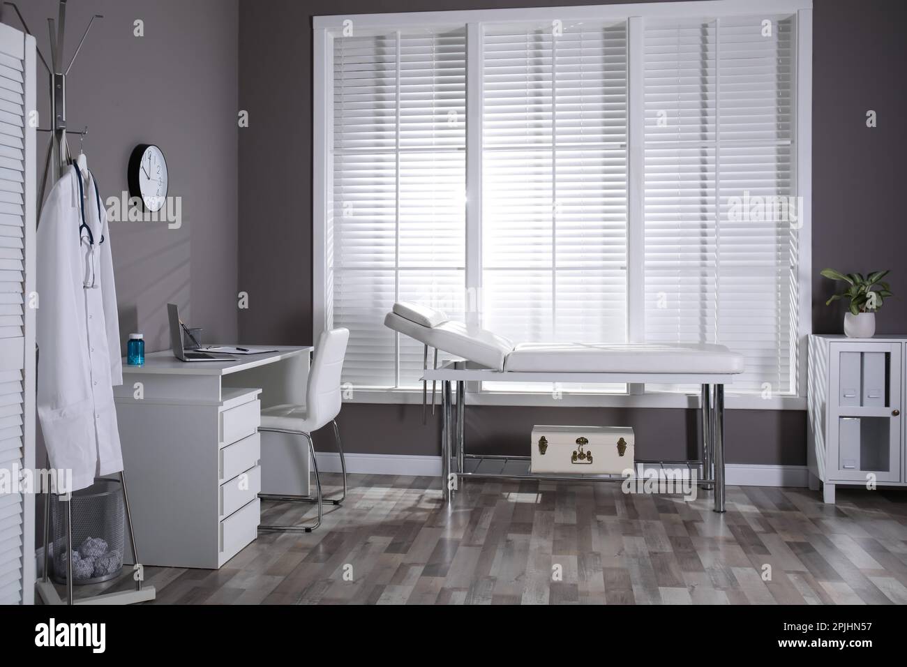Modern medical office interior with doctor's workplace and examination ...