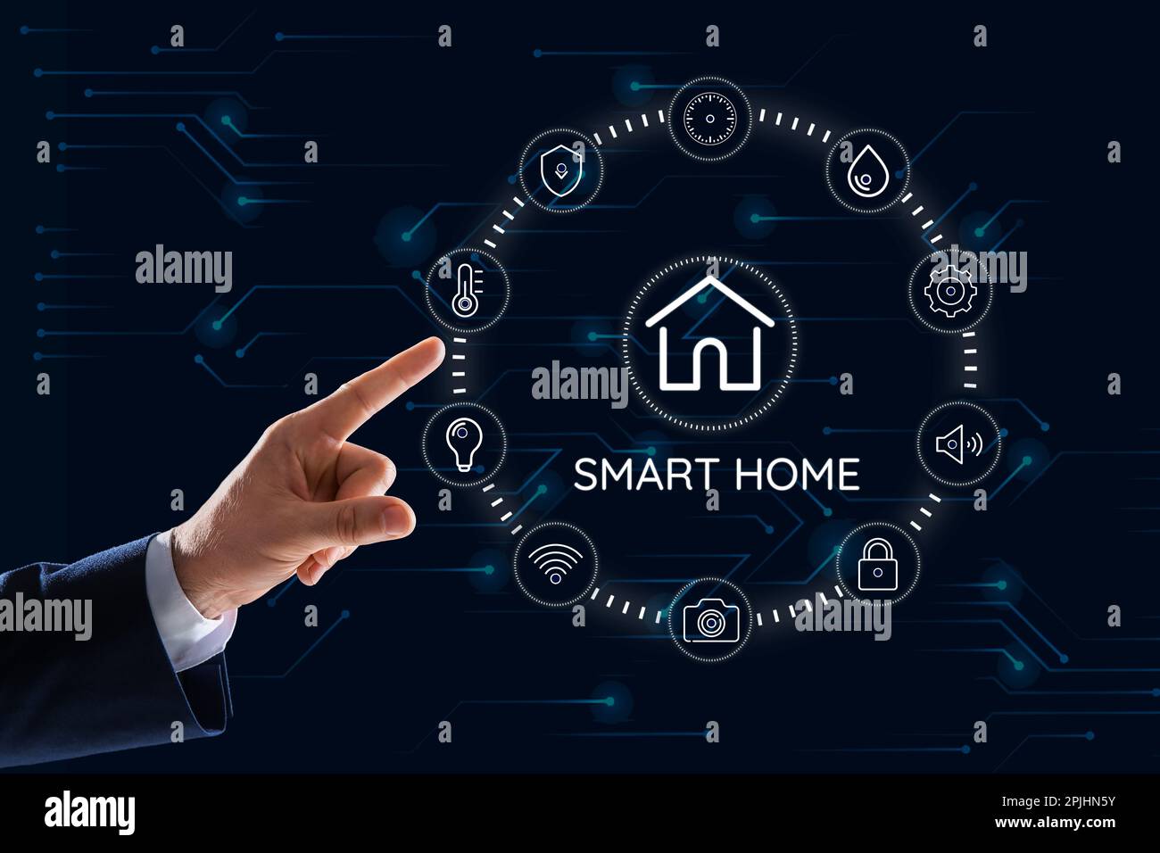 Man using digital screen with Smart Home interface on dark blue ...