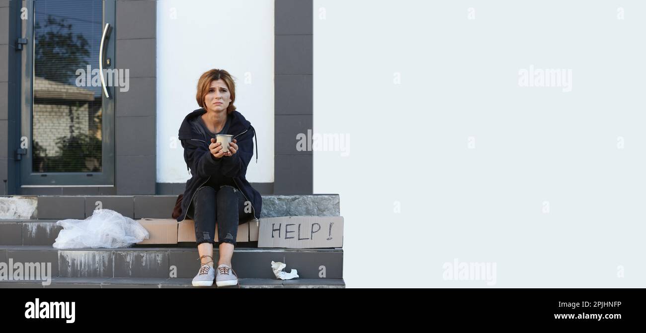Poor woman with mug begging and asking for help on city street, space ...