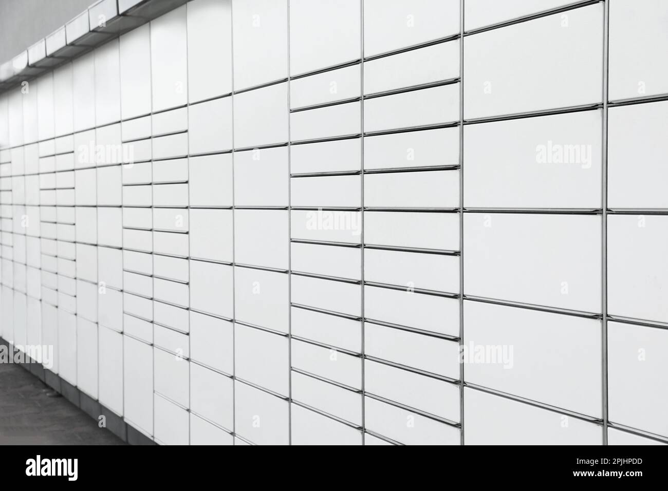 Modern parcel locker with many postal boxes Stock Photo - Alamy