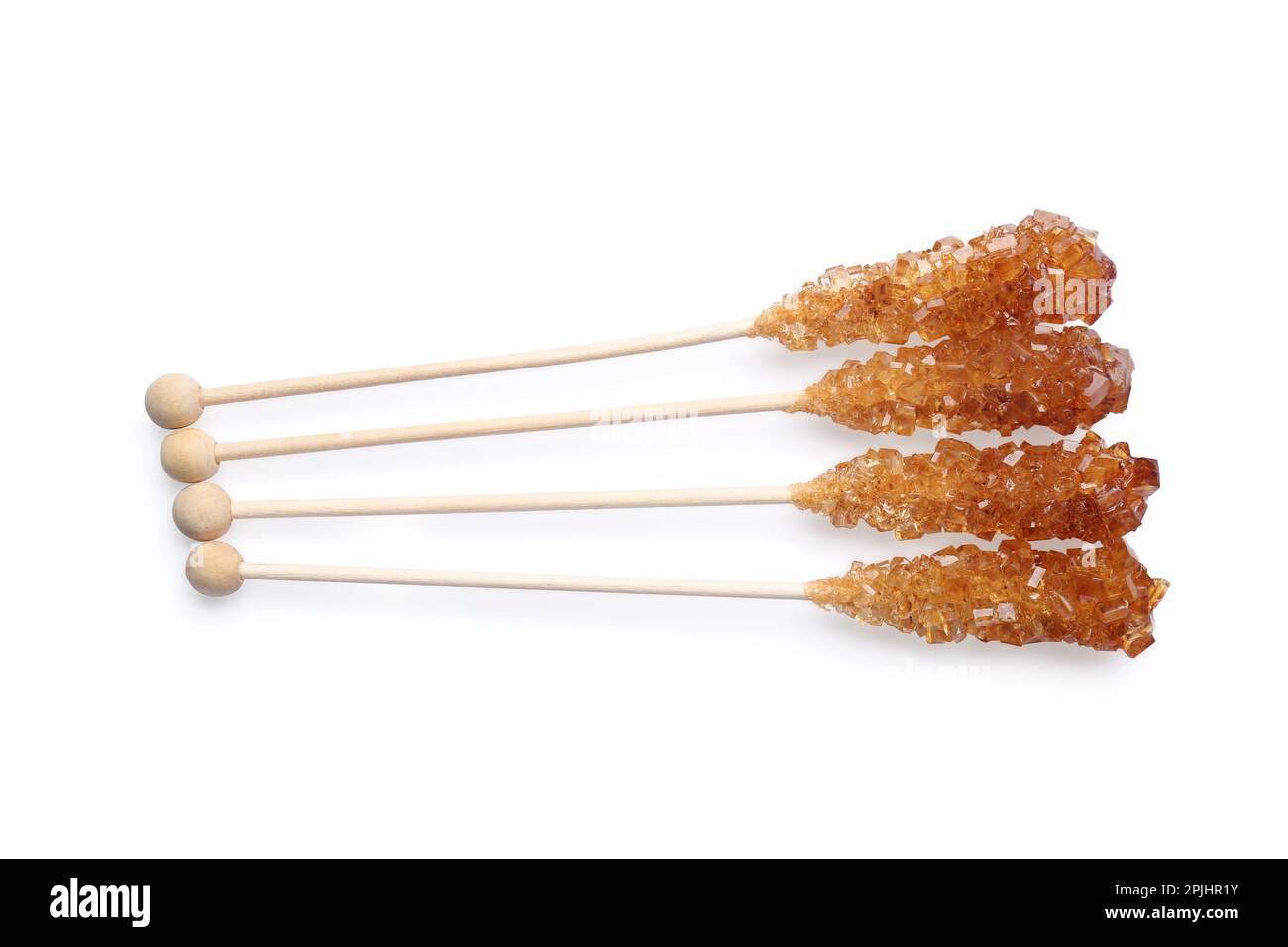Wooden sticks with sugar crystals isolated on white, top view. Tasty ...
