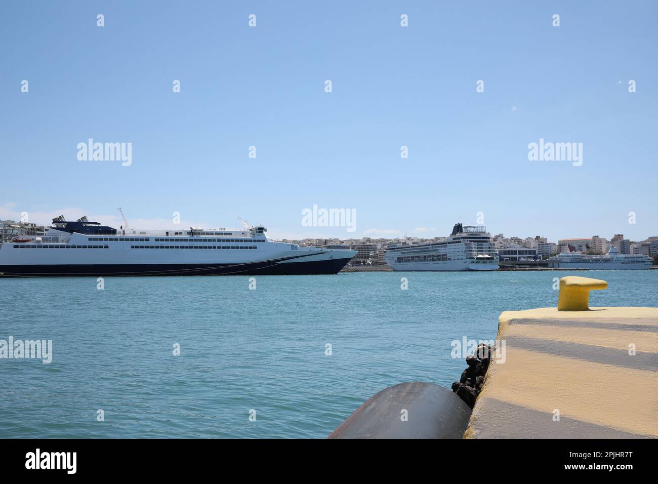 Modern cruise ship and ferry in sea port on sunny day Stock Photo - Alamy