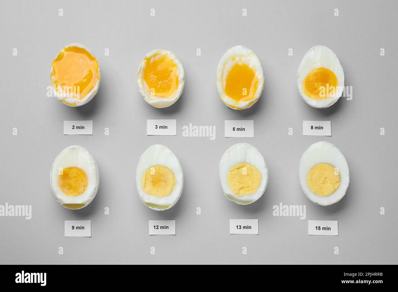 Different cooking time and readiness stages of boiled chicken eggs on ...