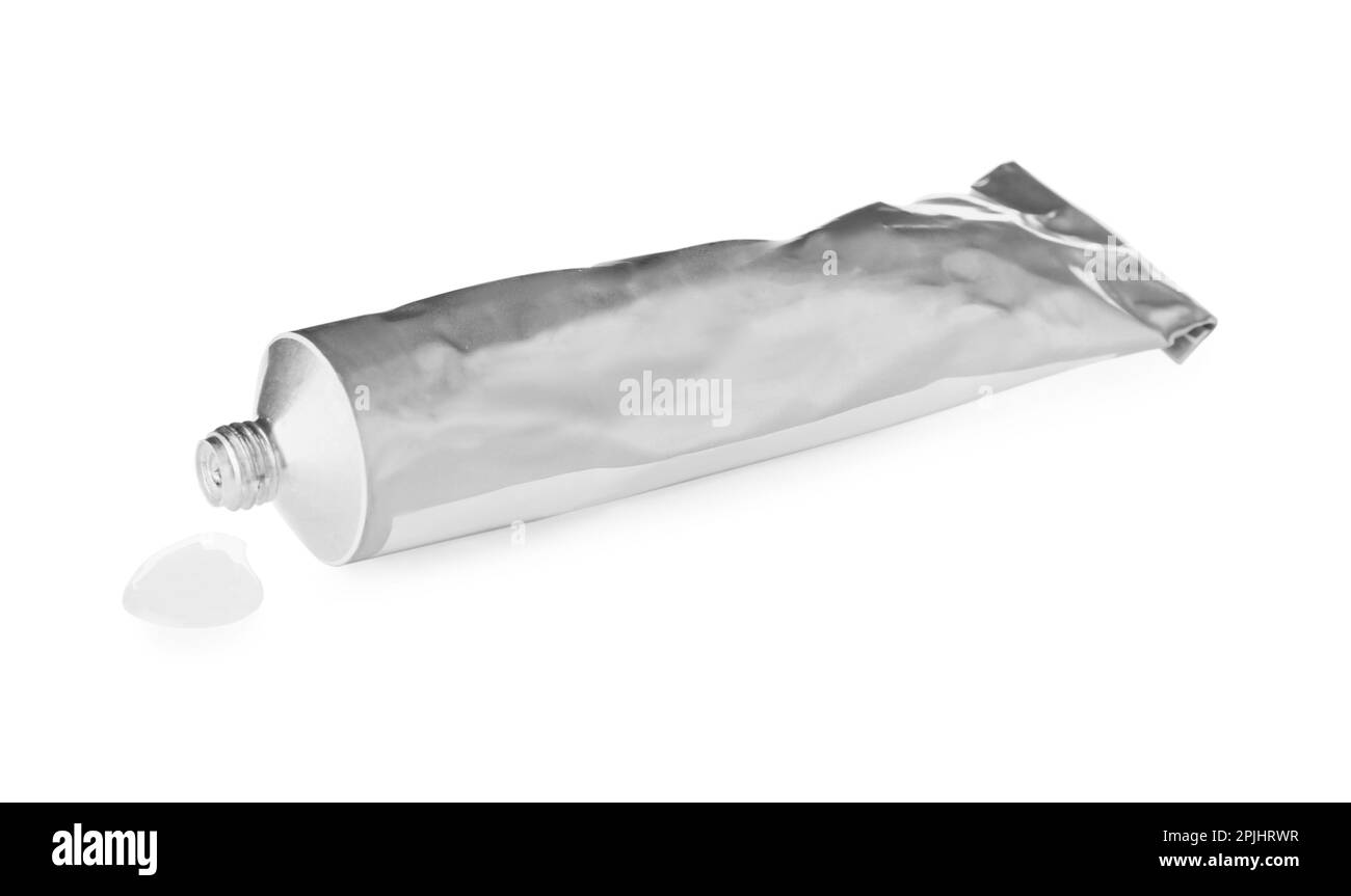Blank tube and drop of glue on white background Stock Photo - Alamy