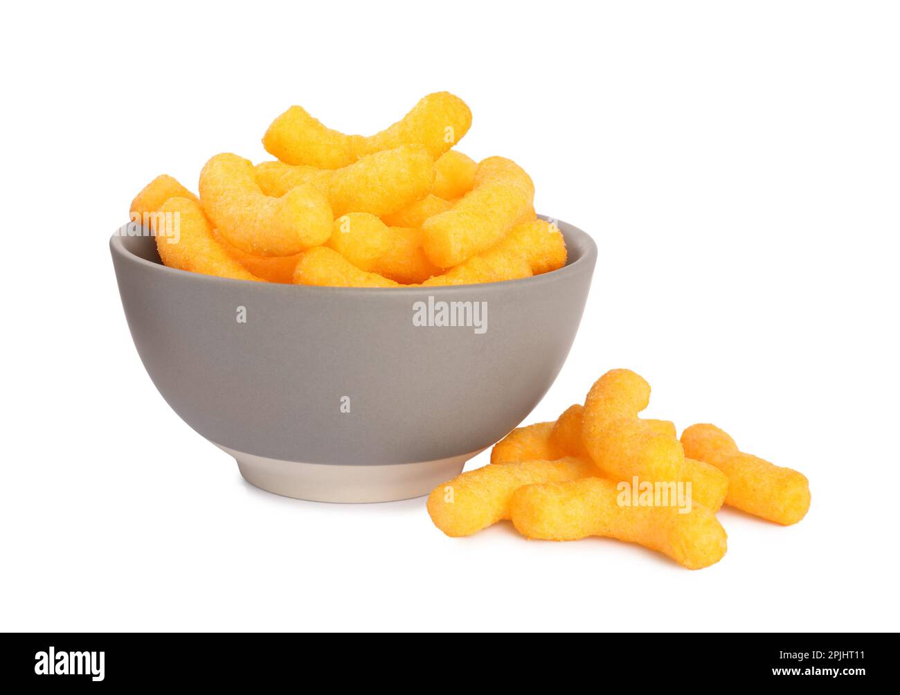 Many tasty cheesy corn puffs in bowl isolated on white Stock Photo - Alamy