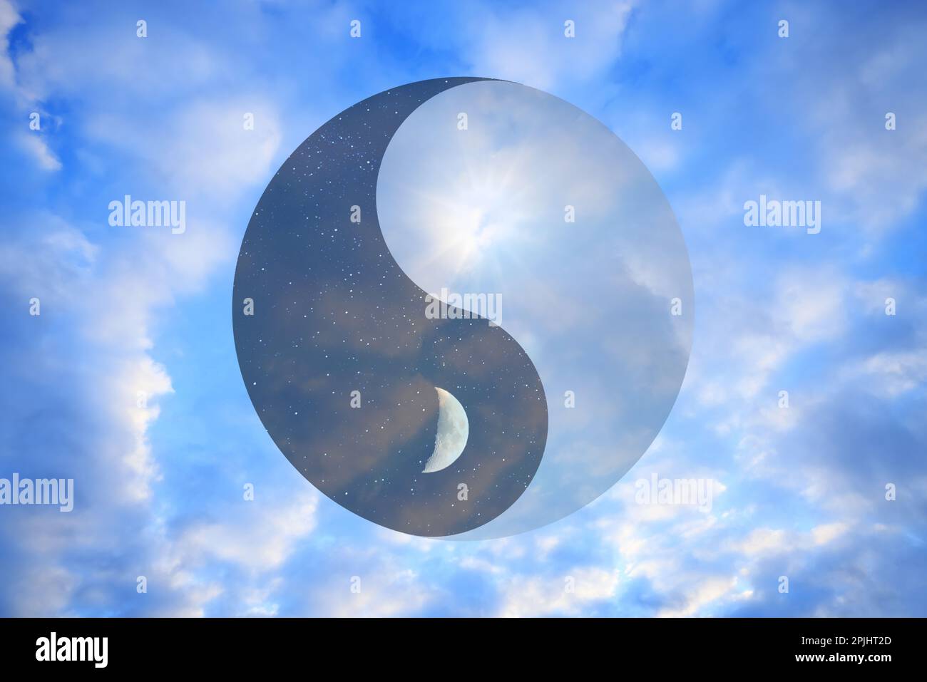 Ying Yang symbol against blue sky. Feng Shui philosophy Stock Photo - Alamy